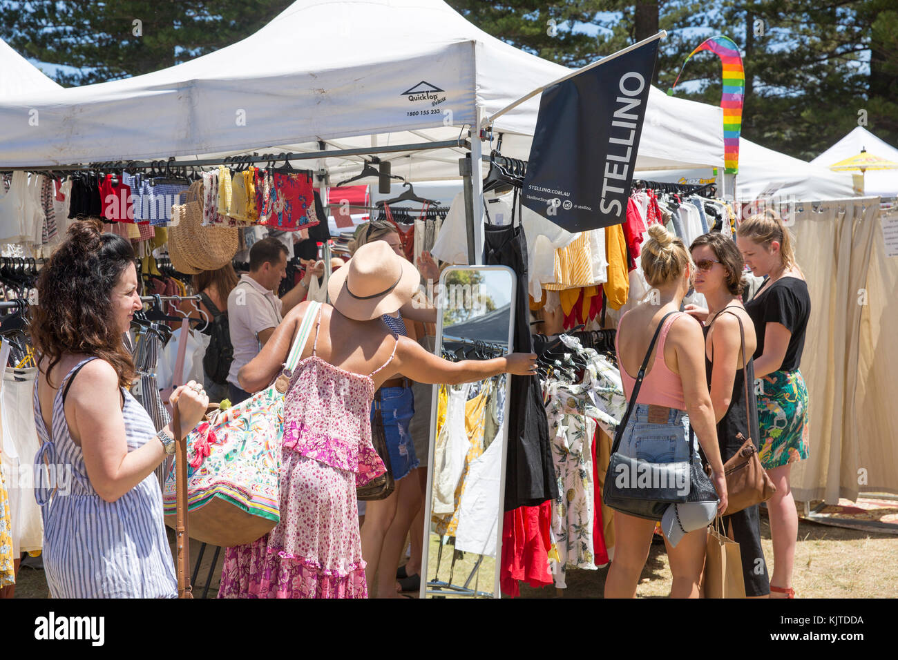 Ladies shopping for clothes at a market stall on Sydney northern ...
