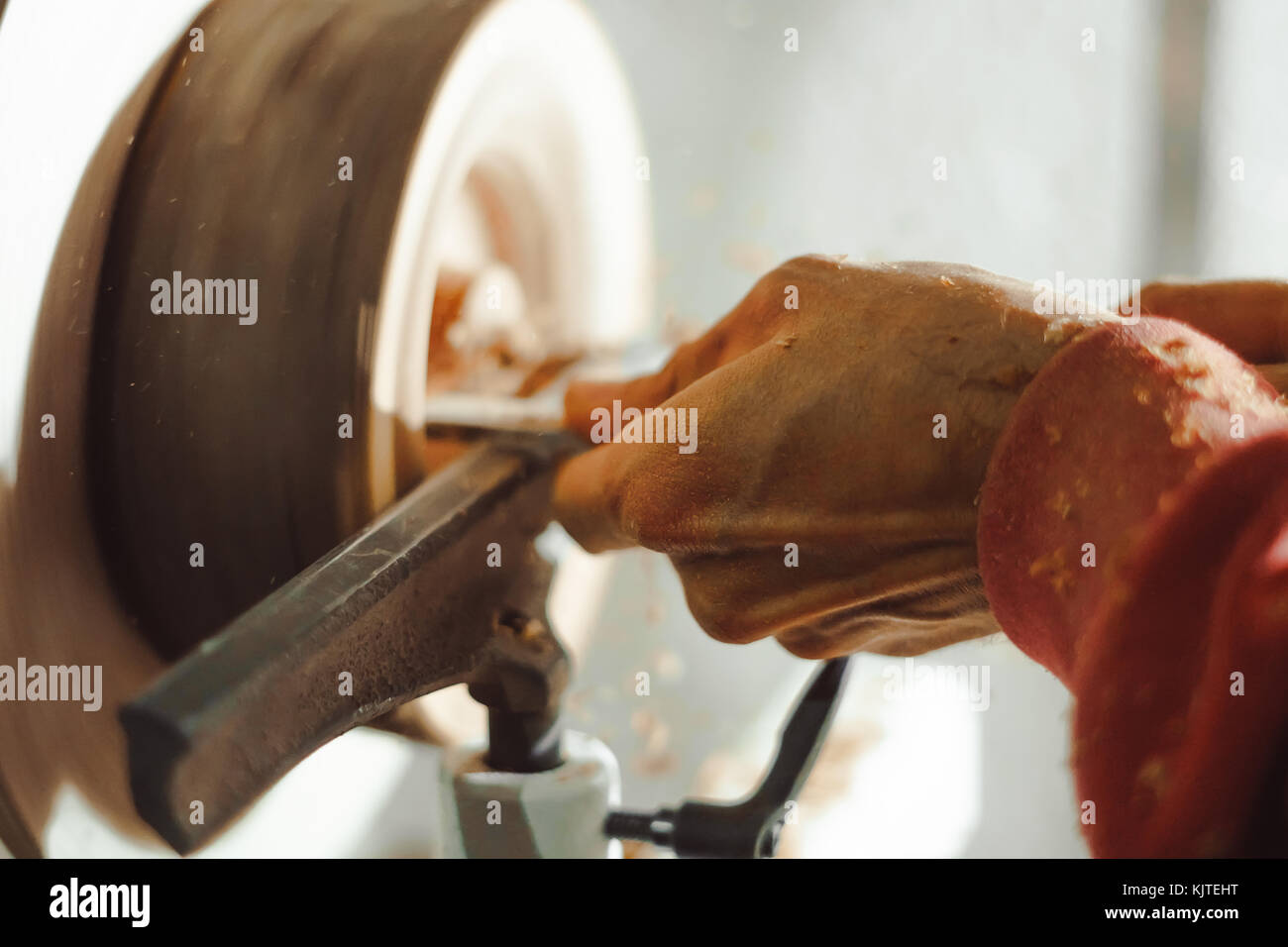 Foot operated spring pole wood lathe.Man operating a foot operated ...