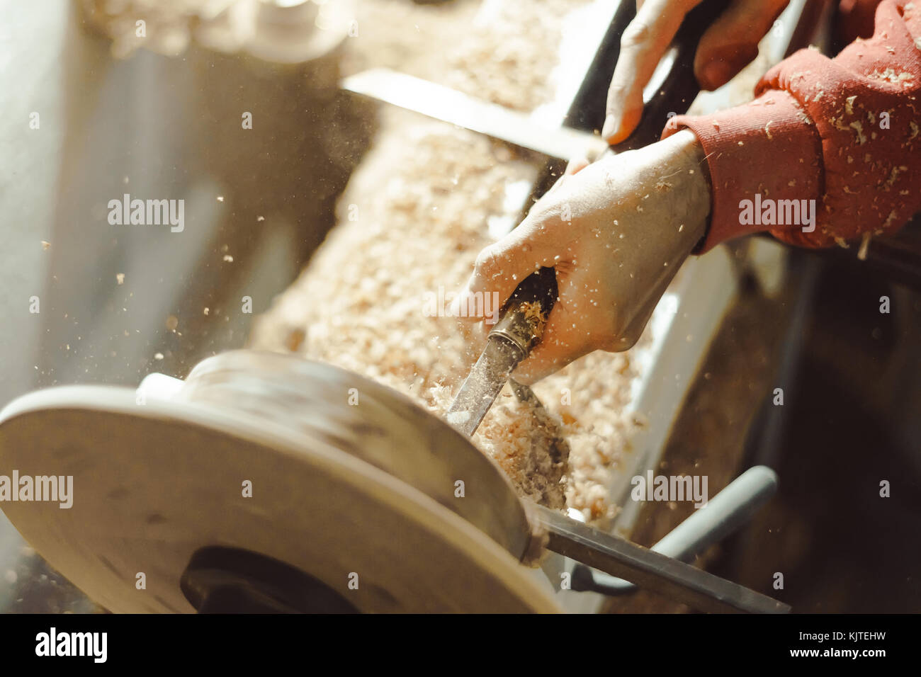 Foot operated spring pole wood lathe.Man operating a foot operated ...