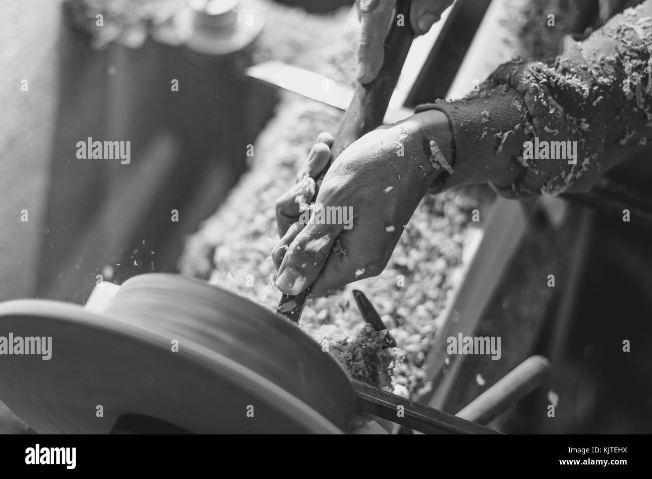 Foot operated spring pole wood lathe.Man operating a foot operated ...