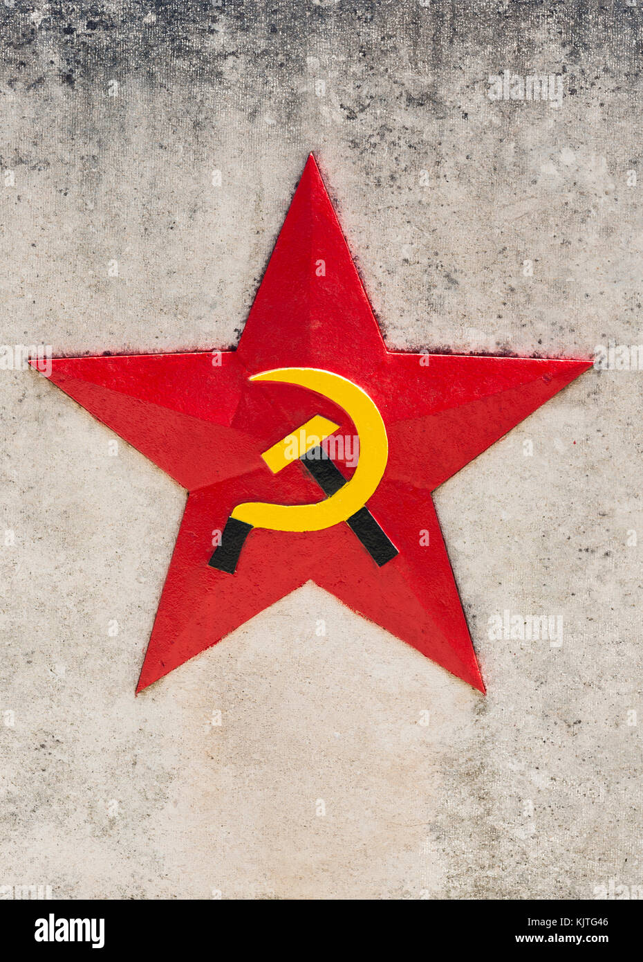 hammer and sickle in a red star on a stone wall Stock Photo - Alamy