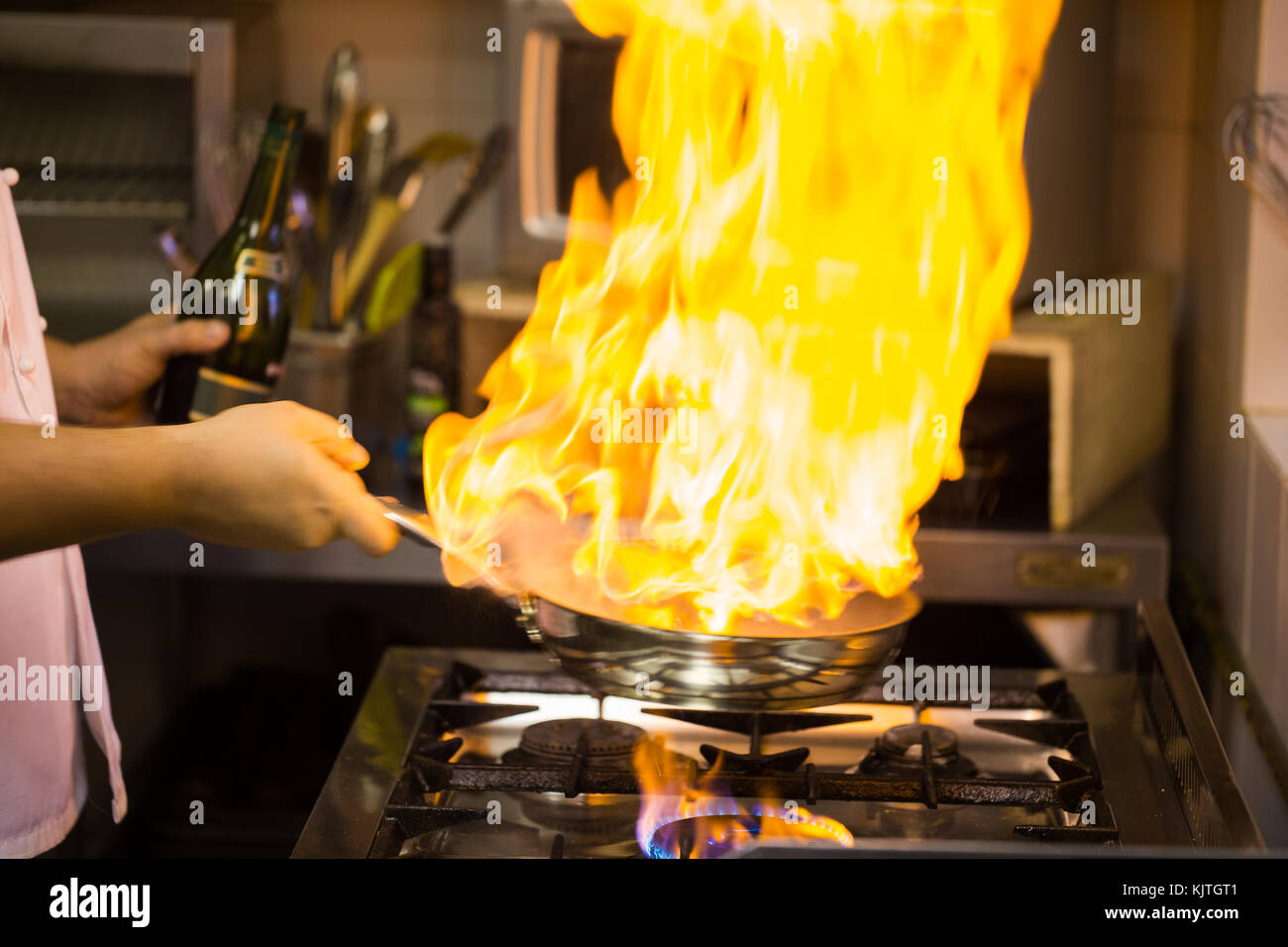 Professional chef cooking flambe style hi-res stock photography and ...