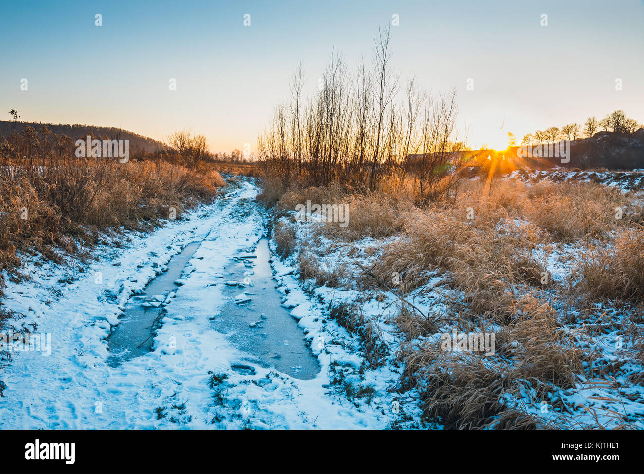Winter landscape with snow on the ground, sunset Stock Photo - Alamy