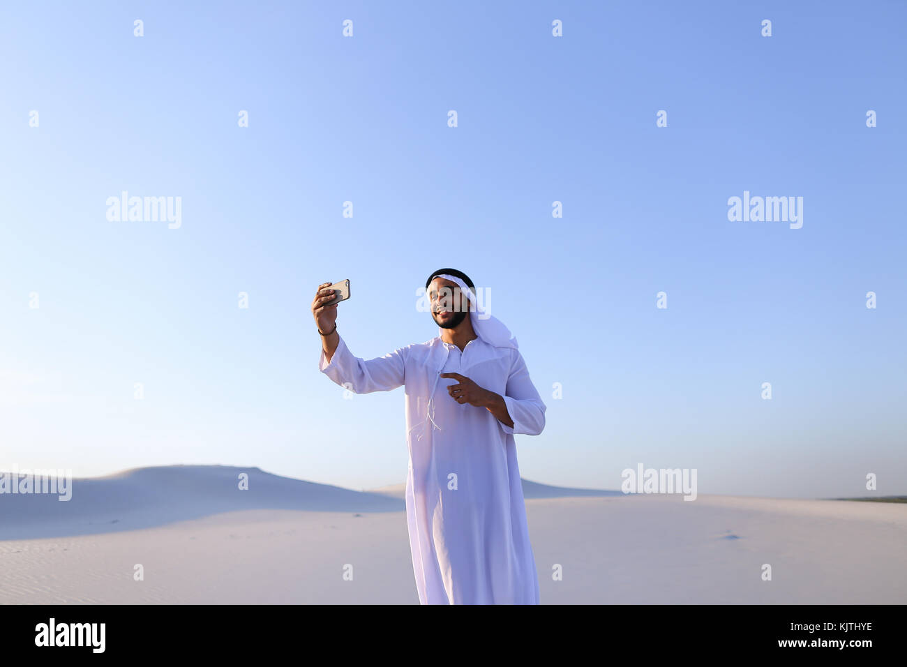 Portrait of Arabian sheikh man with gadget that communicates in Stock ...