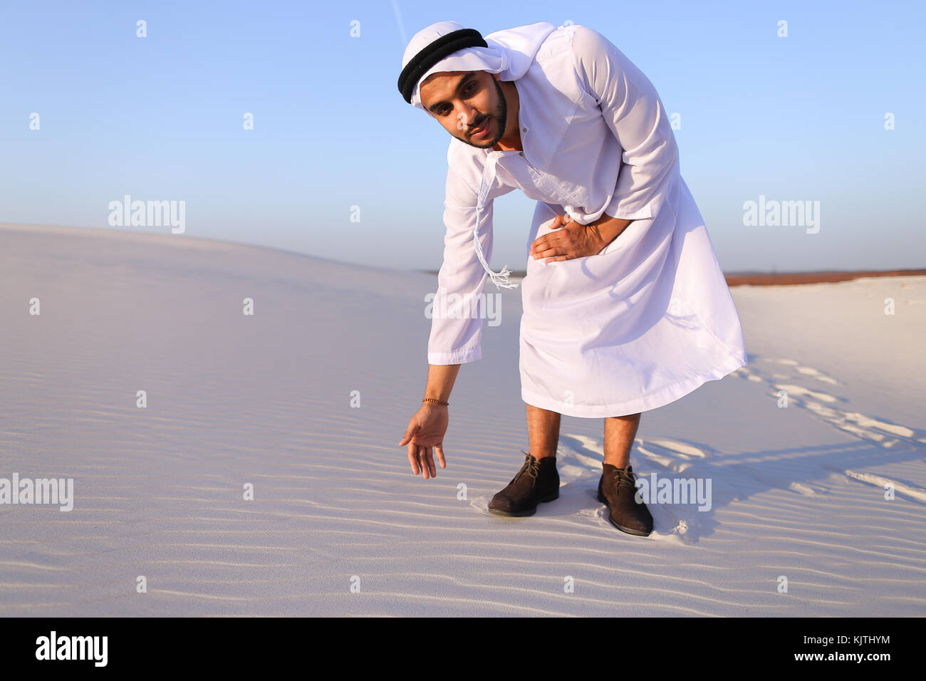 Muslim man develops sand along wind and standing in middle of de Stock ...