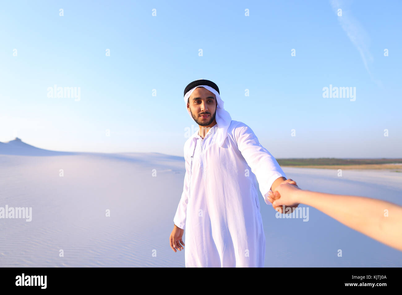 Portrait of beautiful Emirate male tourist guide, who holds woma Stock ...
