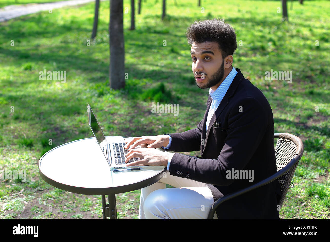 Journalist finished work in park Stock Photo - Alamy