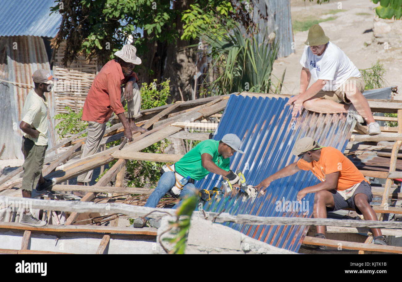 Men working on Village of Bonbon Haiti homes after hurricane Matthew ...