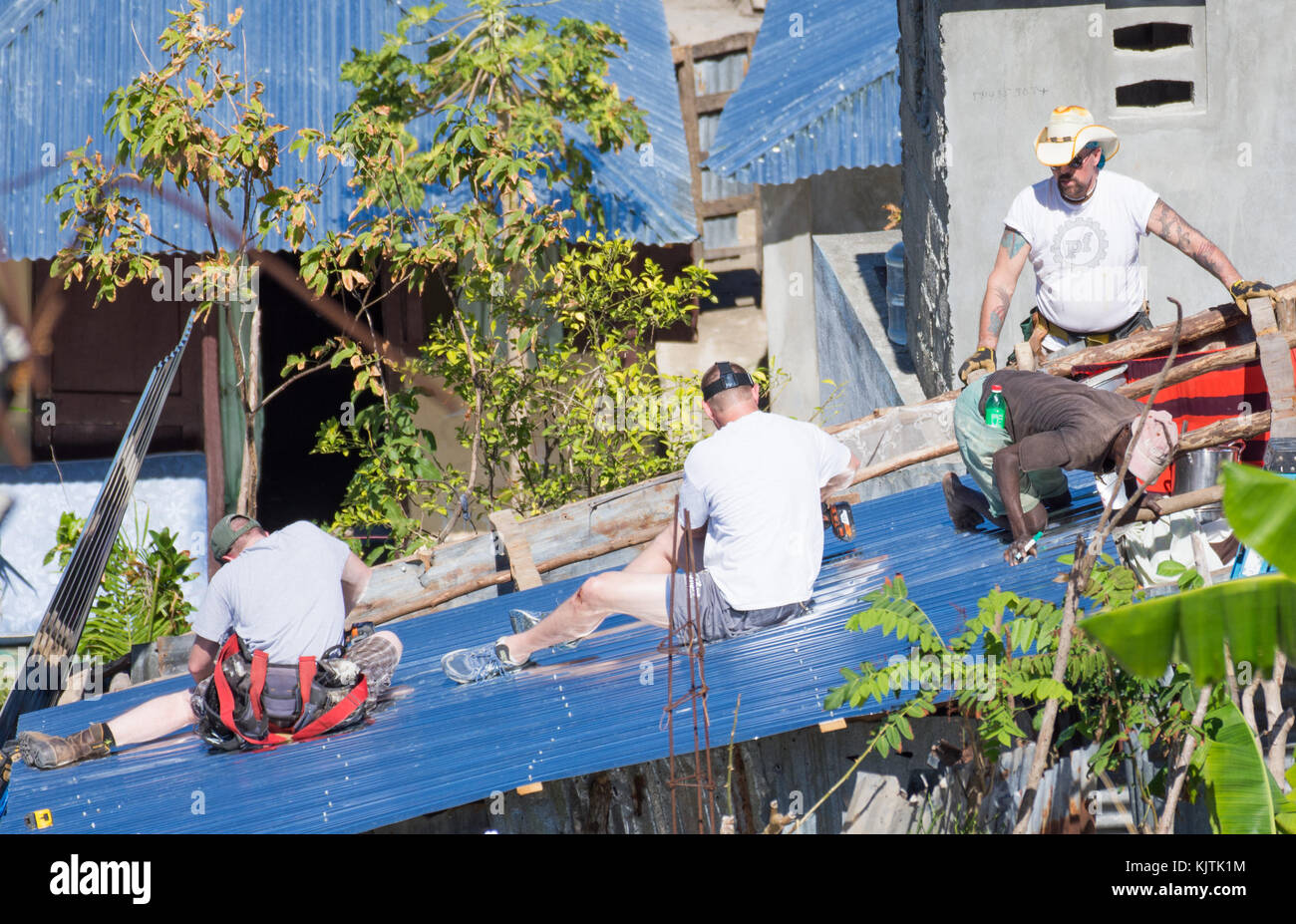 Men working on Village of Bonbon Haiti homes after hurricane Matthew ...