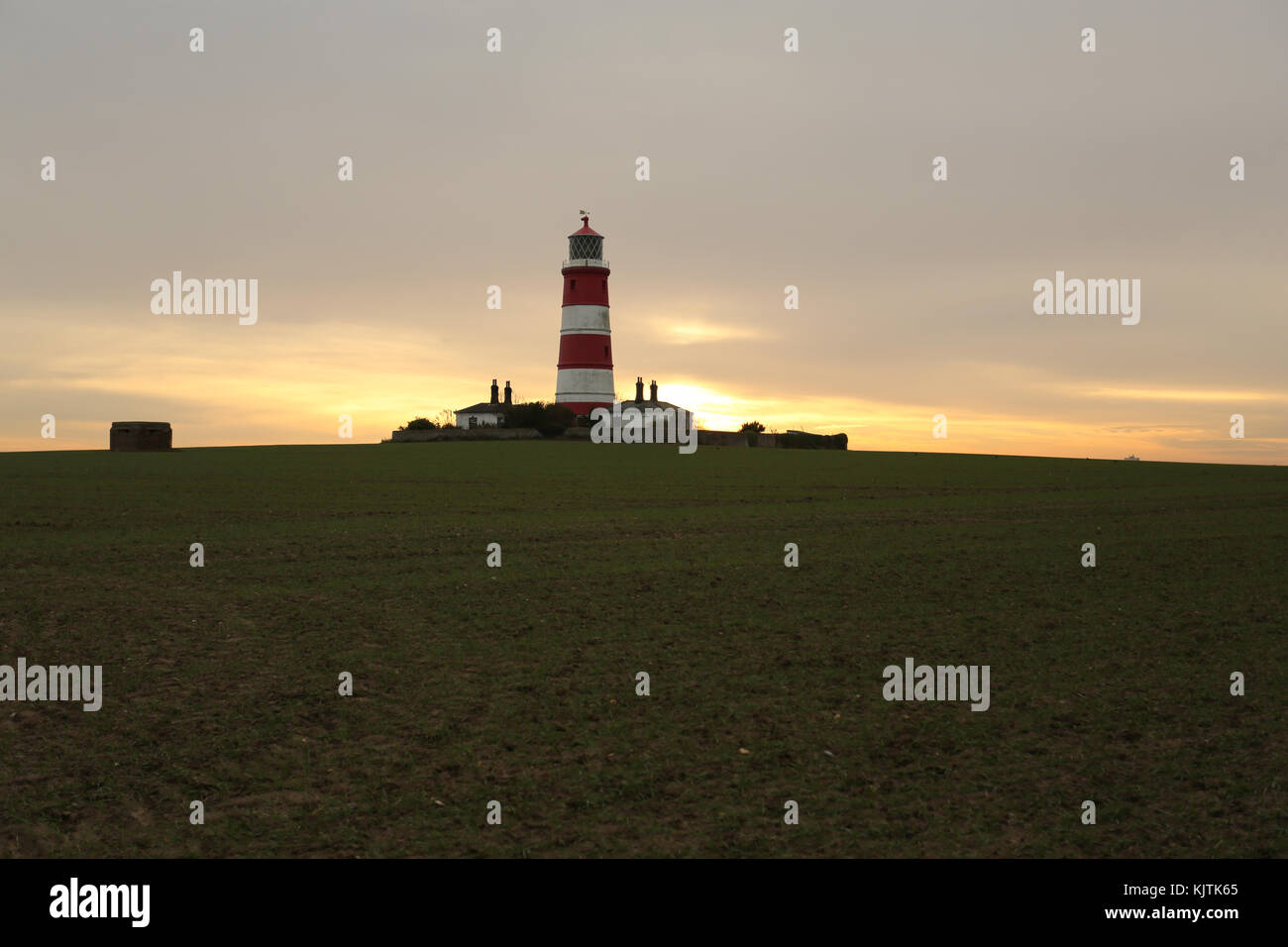 A Landscape view of Happisburgh Lighthouse in Happisburgh at sunset on ...