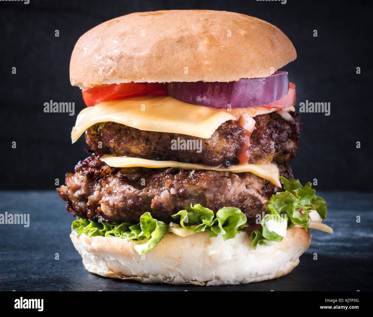 Juicy double beef cheeseburger,selective focus and close up Stock Photo ...