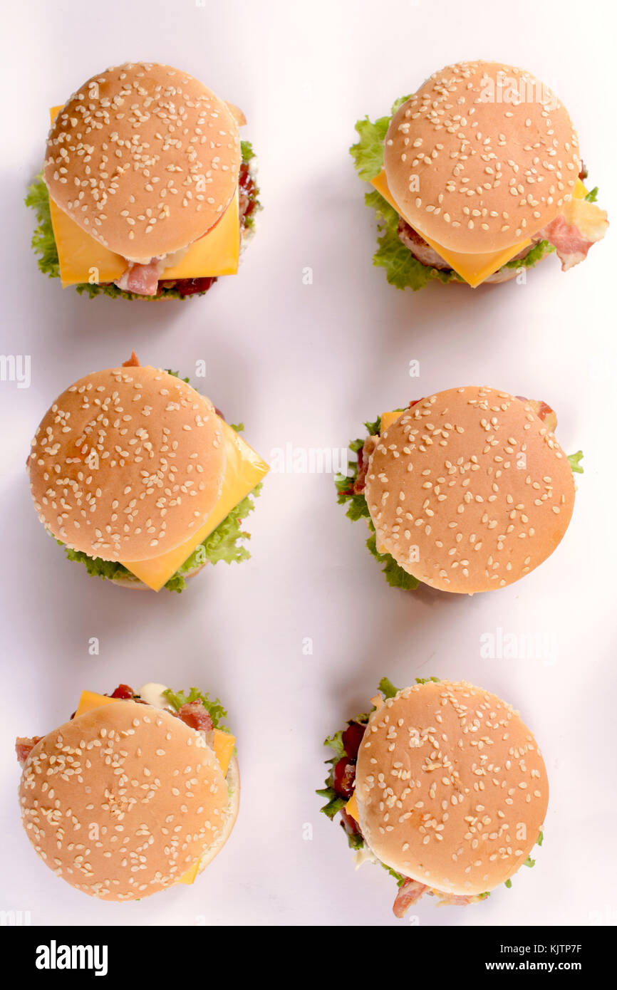 Mini beef burgers from above on white background with shadows Stock ...