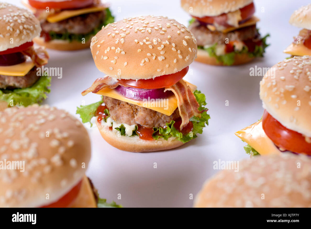 Mini beef burgers on white background,selective focus in the middle ...