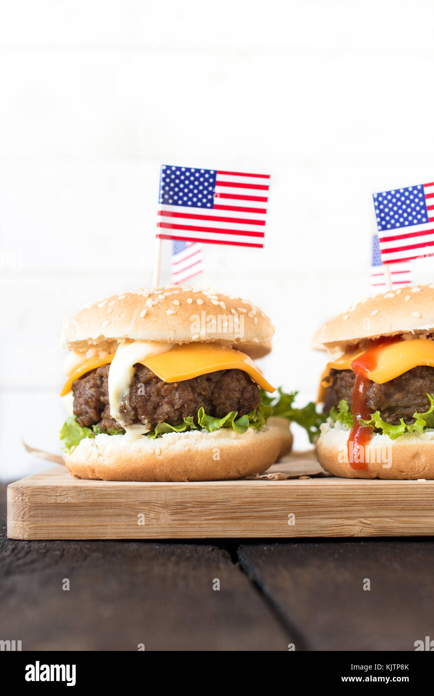 Mini beef burgers with American flag on wooden board,selective focus ...