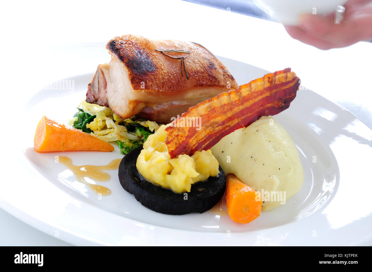 plated pork dinner meal Stock Photo - Alamy