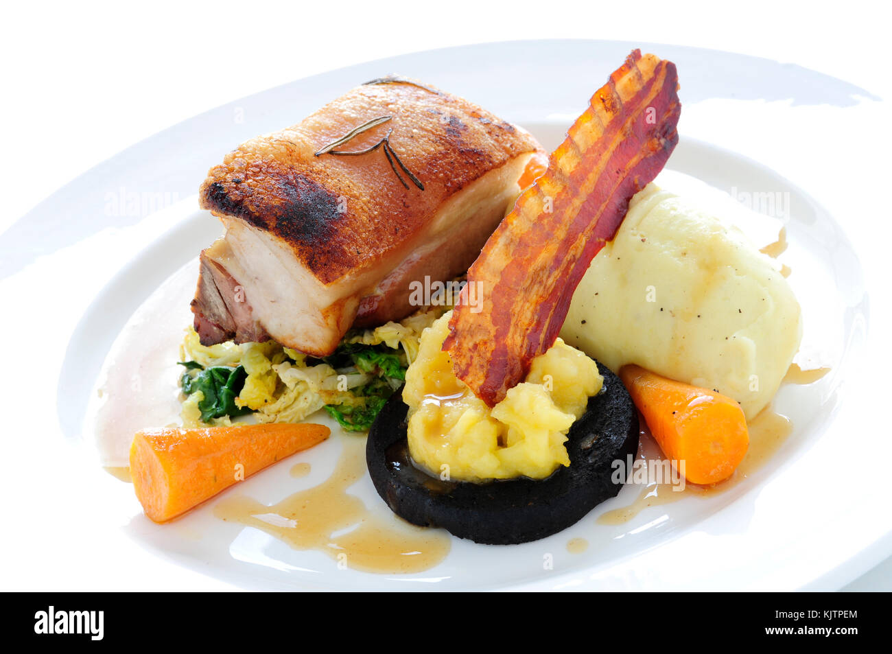 plated pork dinner meal Stock Photo - Alamy