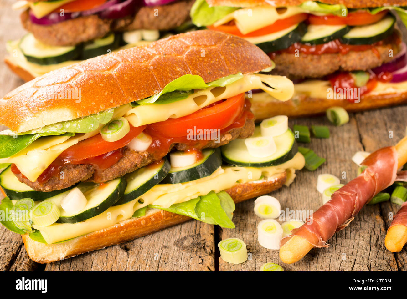 Selective focus on the front beef sandwich Stock Photo - Alamy