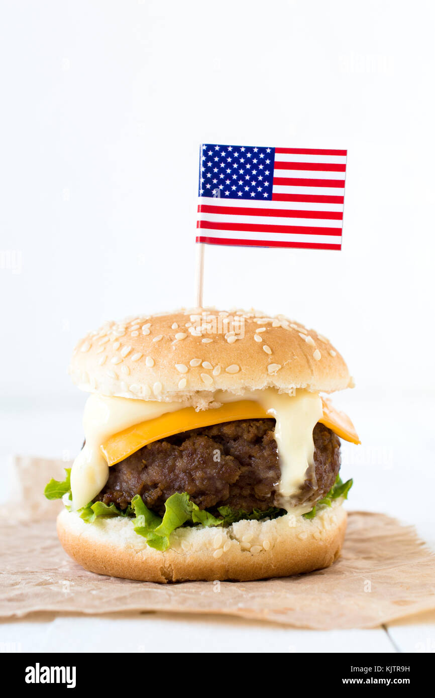 Single American mini beef burgers with cheese and USA flags,selective ...