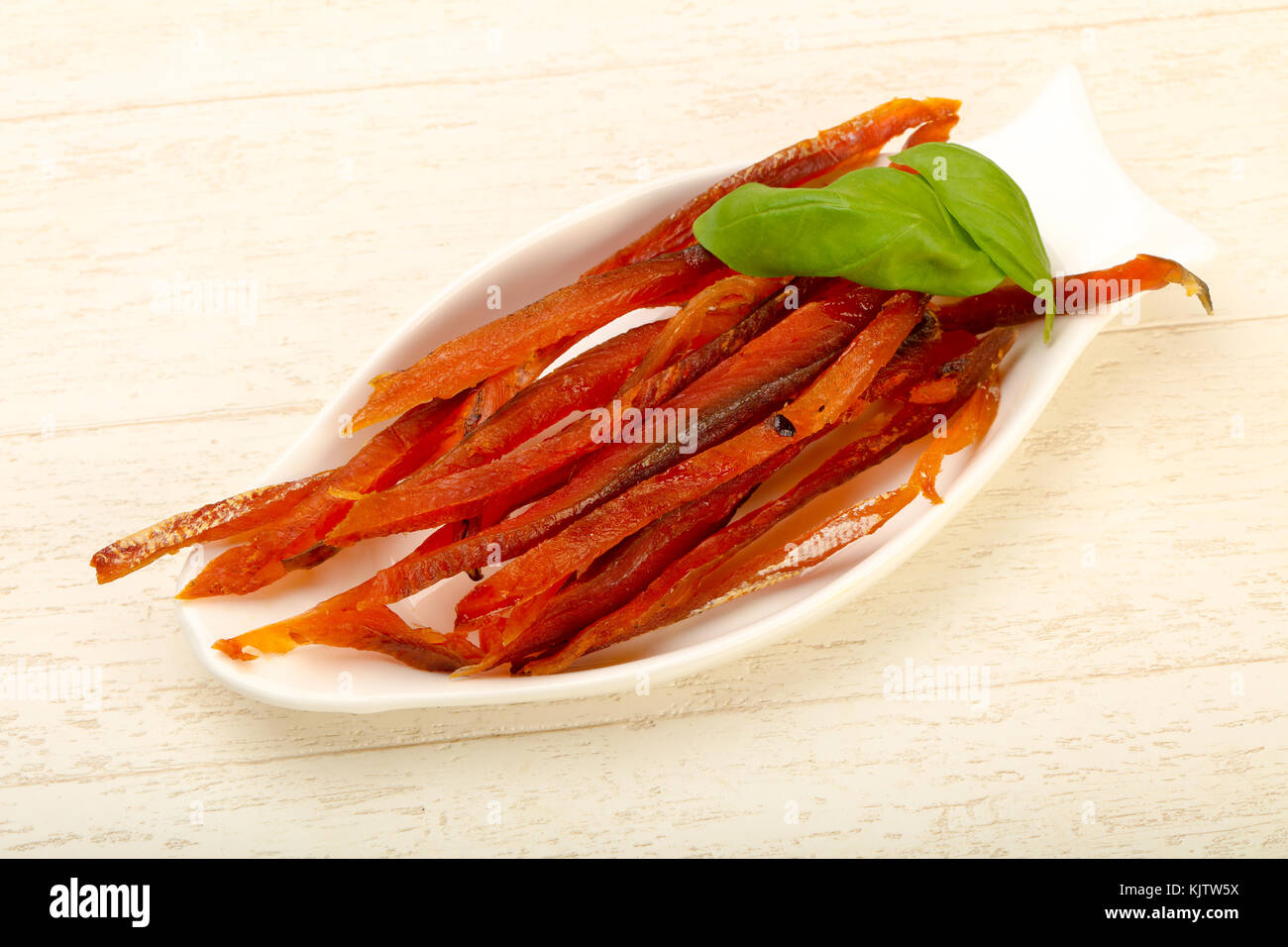 Salmon dry sticks snack Stock Photo - Alamy