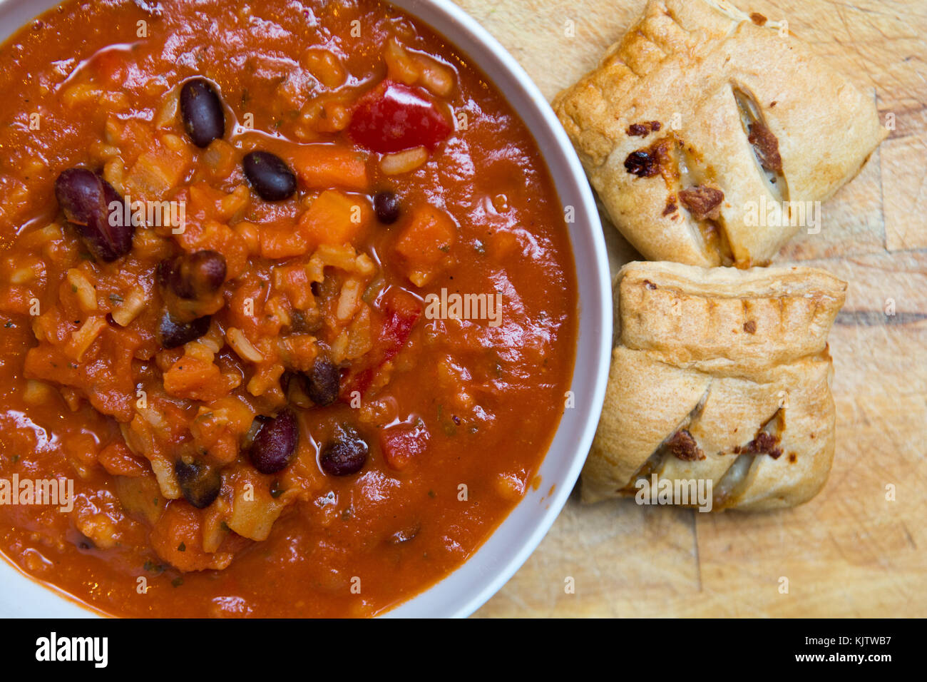 Warming bean and rice soup in a bowl with bread Stock Photo - Alamy