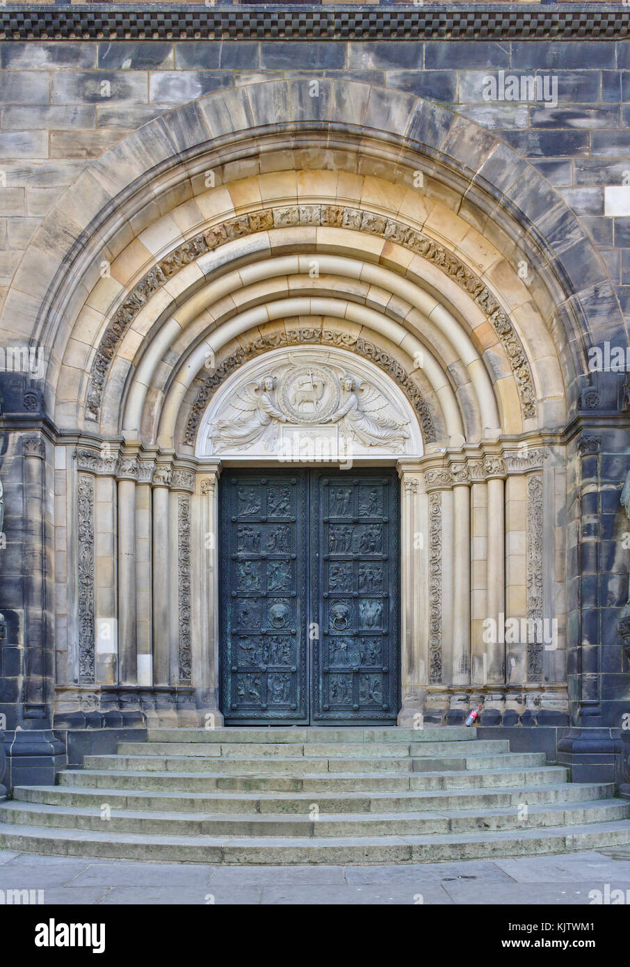 Historic church door with steps and ornamented archway Stock Photo - Alamy