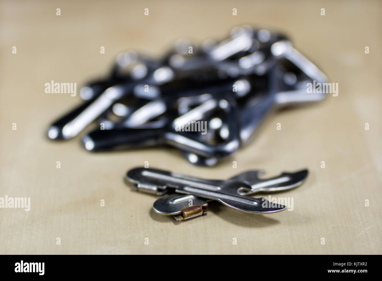 Simple metal plate opener on the countertop in the restaurant. A silver ...