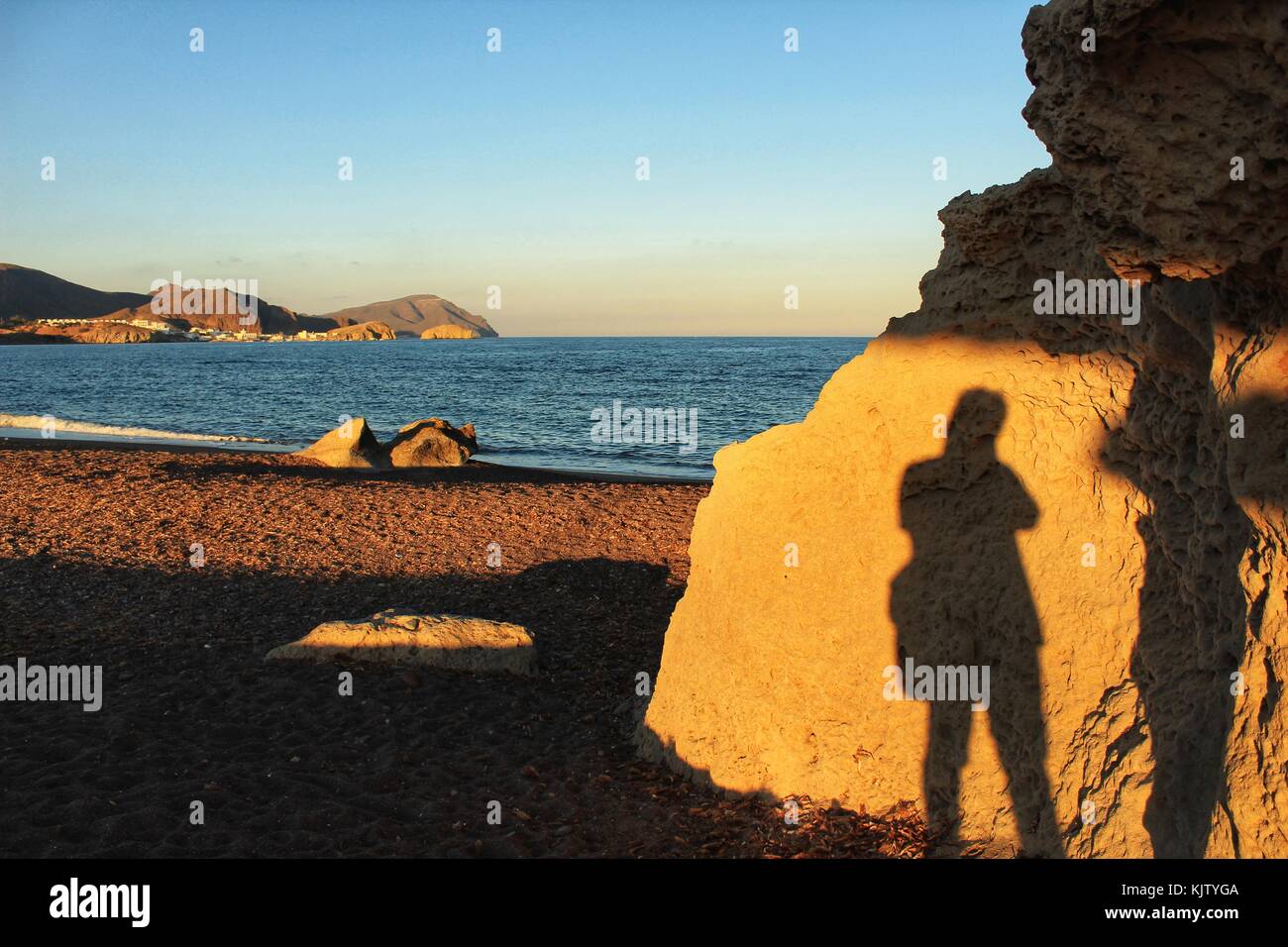Rock formations on the beach at sunset Stock Photo - Alamy