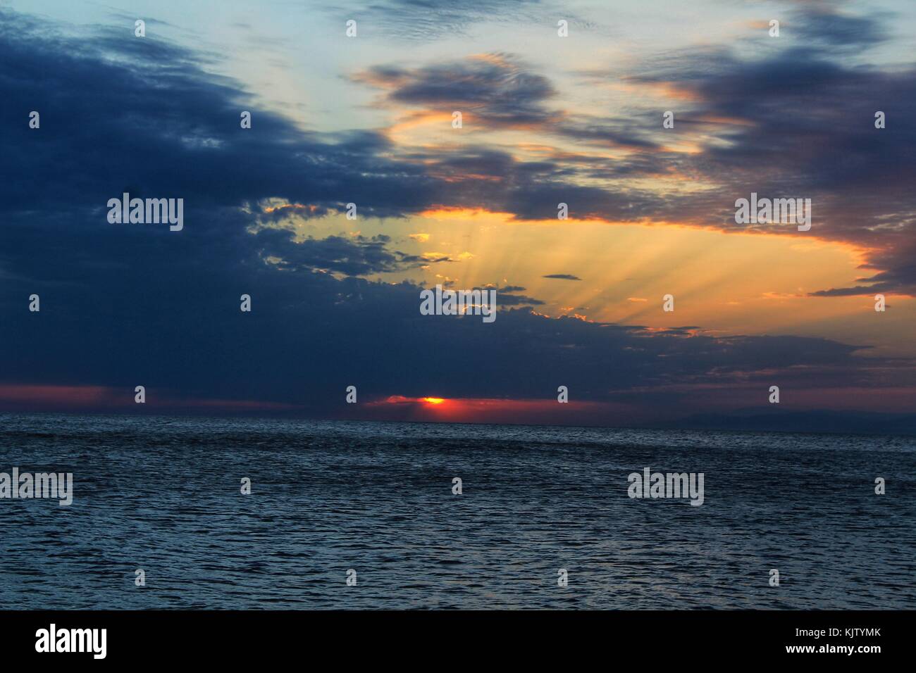 Sunset on the beach Stock Photo - Alamy