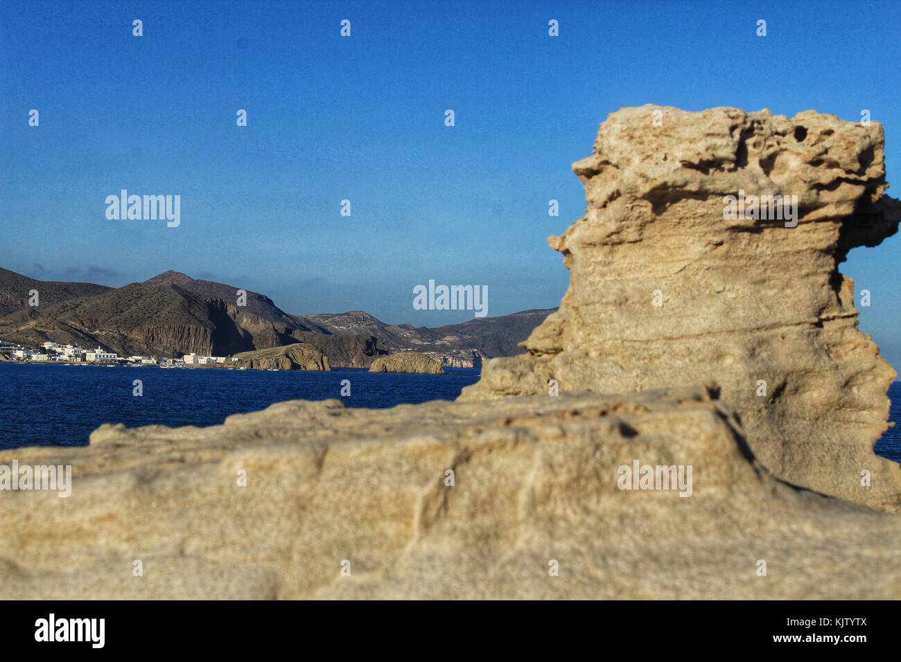 Rock formations on the beach at sunset Stock Photo - Alamy