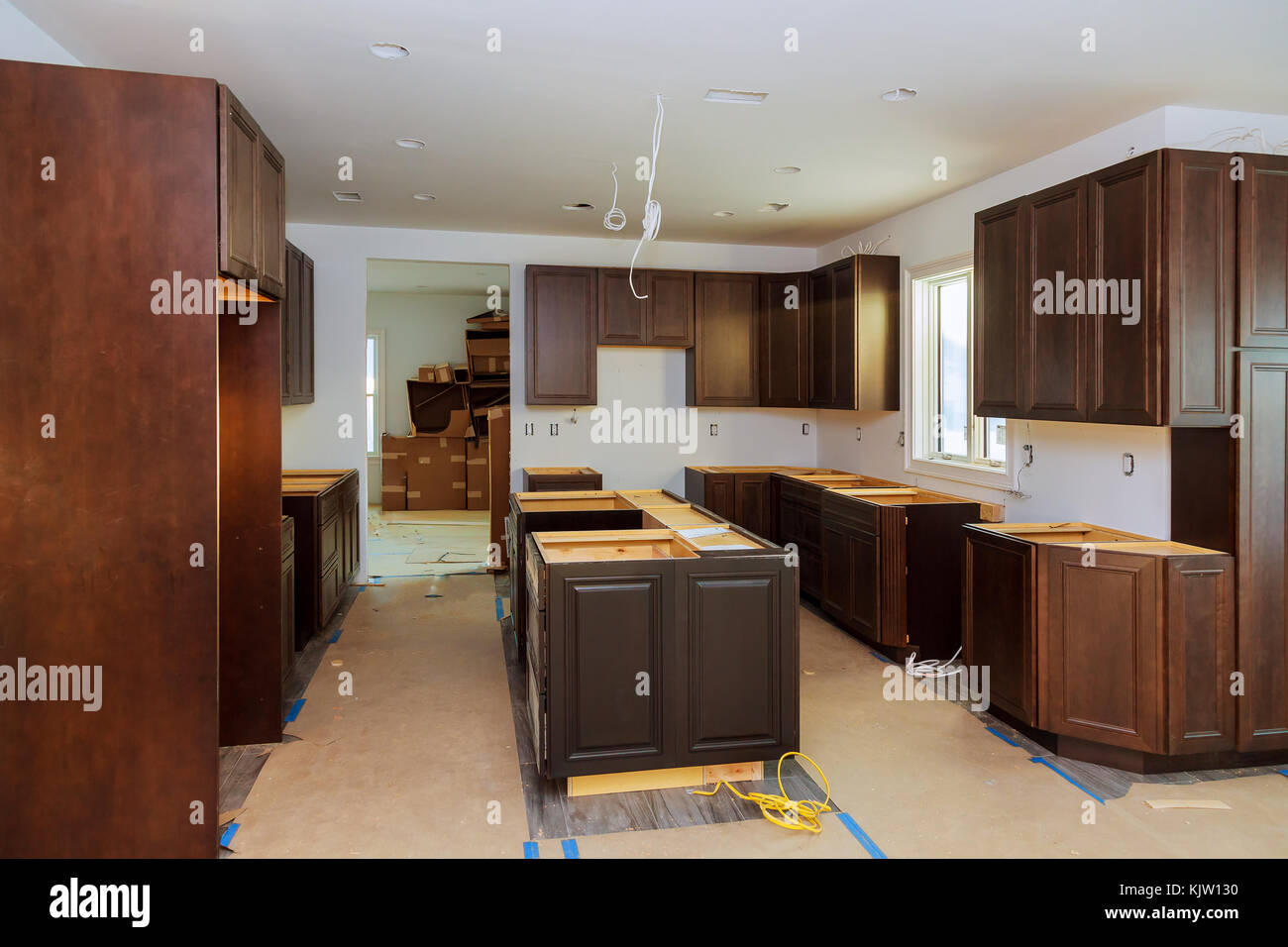 Custom kitchen cabinets in various stages of installation base for ...