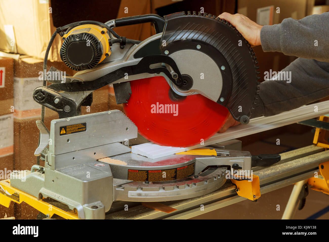 Wood cutting with circular saw Close-up of carpenter cutting a wooden ...