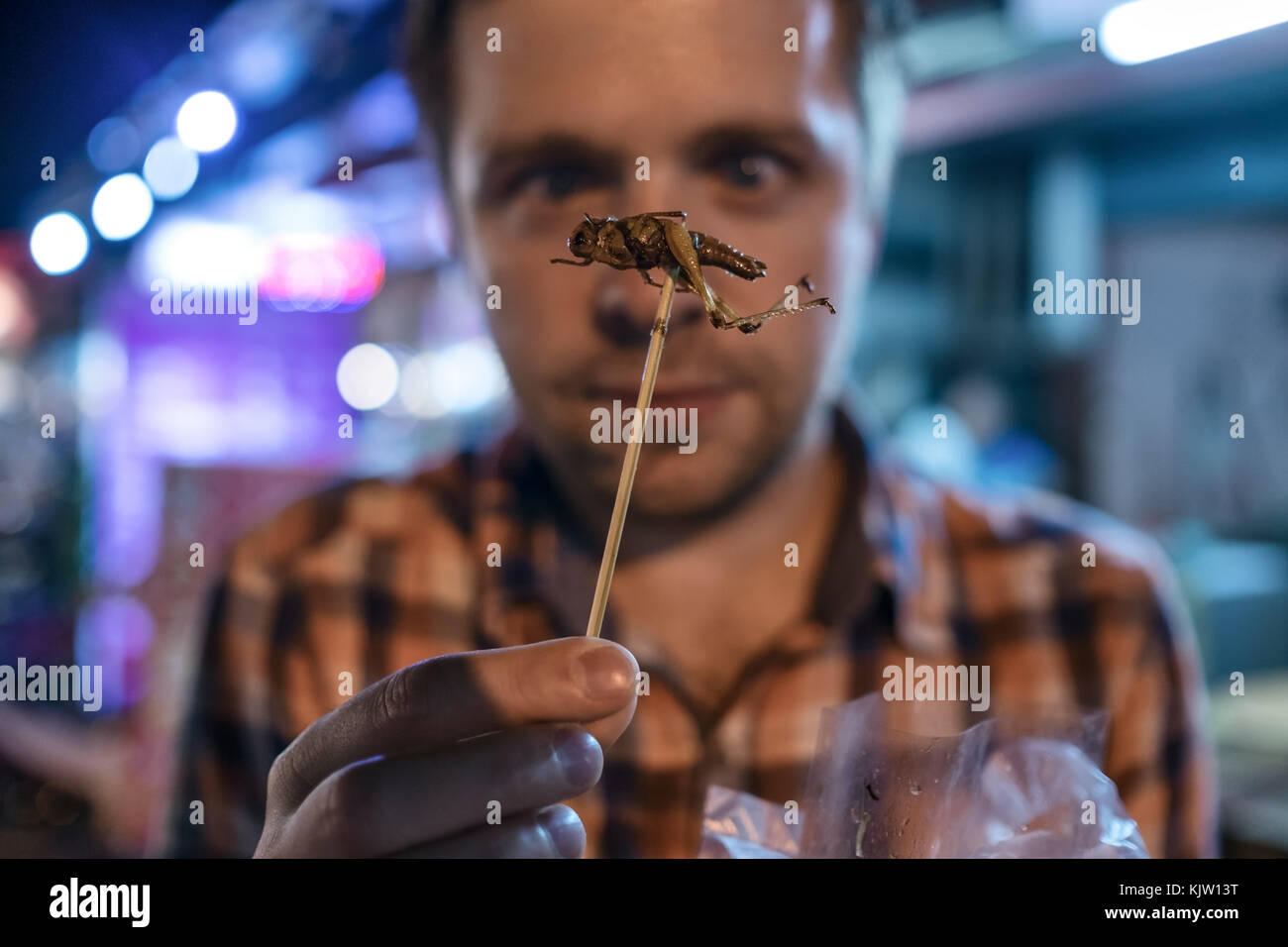 Human eating insect hi-res stock photography and images - Alamy