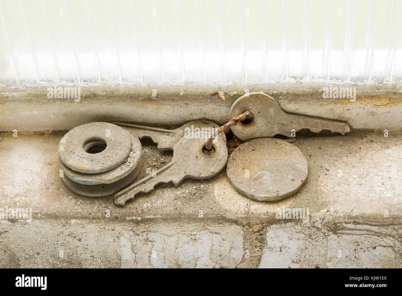 A set of keys were forgotten in the frame of a window of a garage next ...