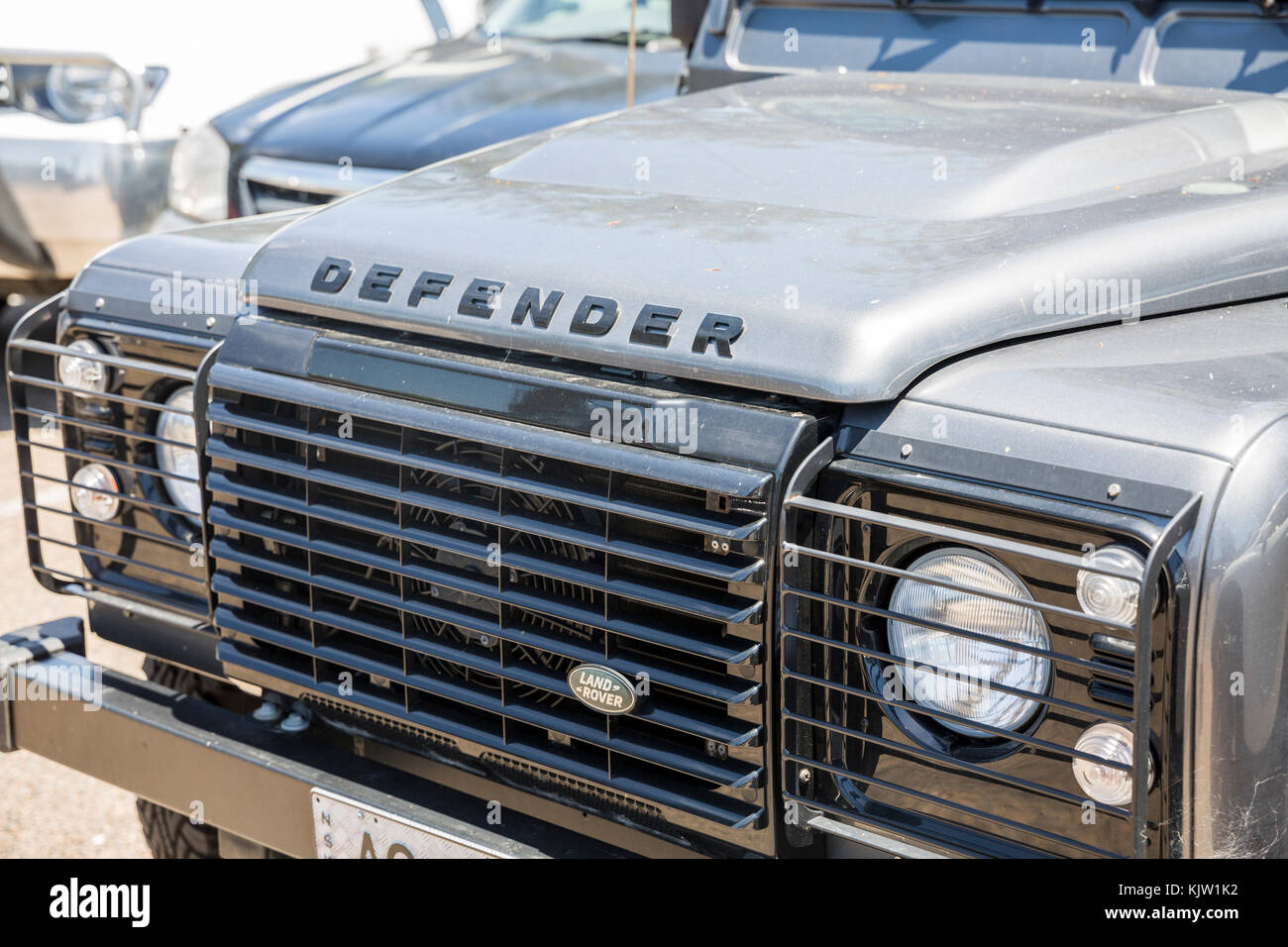 Front view of grey land rover defender vehicle car Stock Photo - Alamy