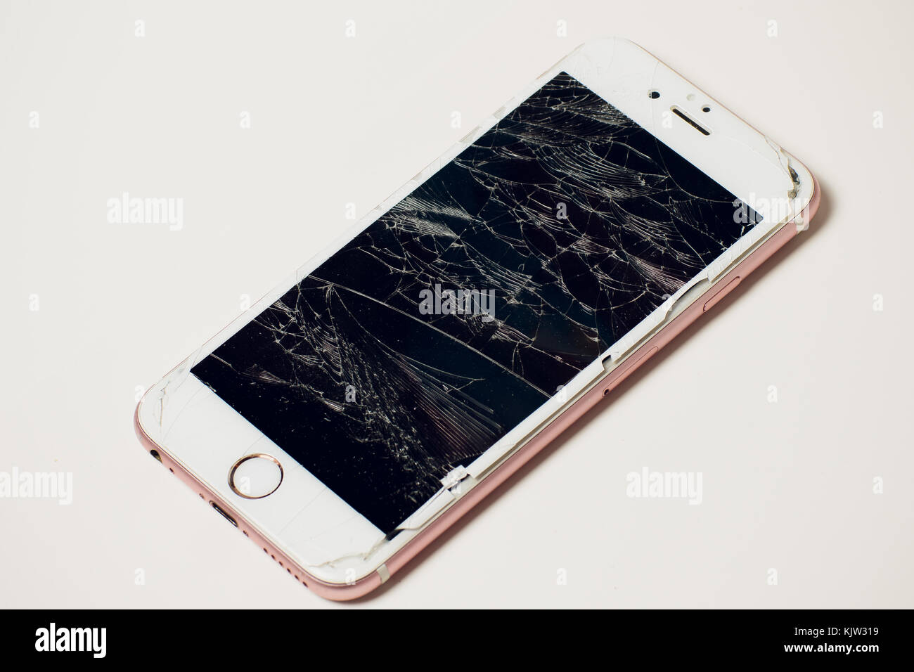 Modern mobile smartphone with broken screen isolated on white ...