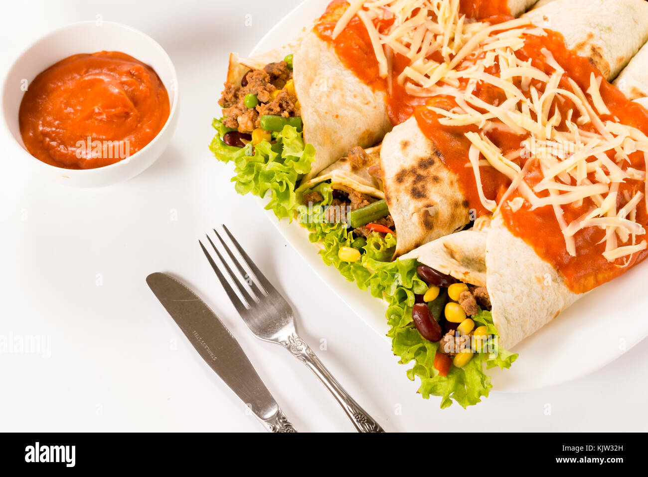 Three burrito sandwich and salsa sauce on white background Stock Photo ...