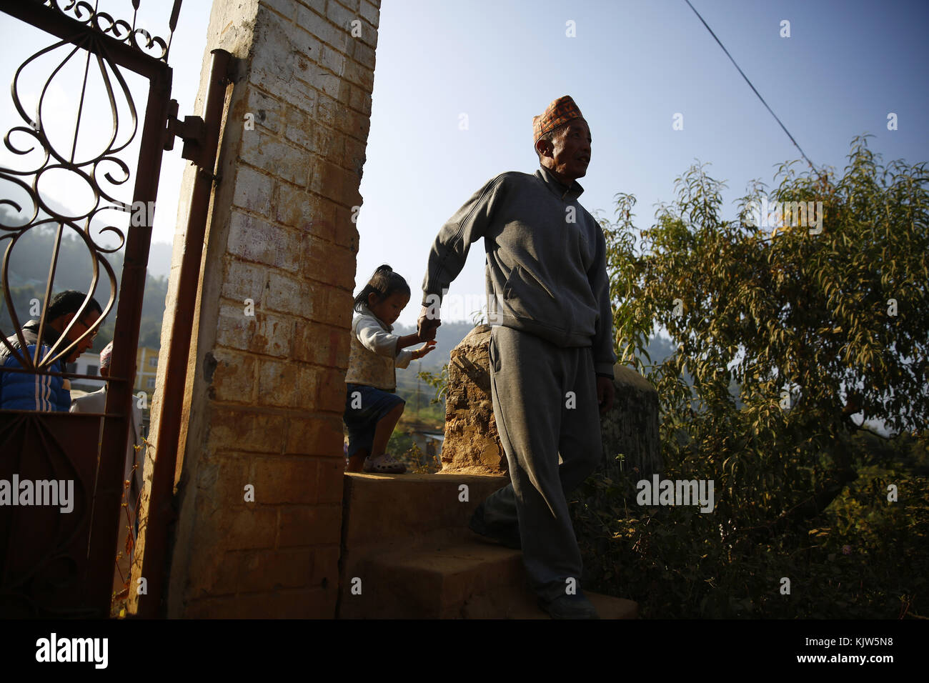 Phidim, Nepal. 26th Nov, 2017. People walk inside the entrance to cast ...