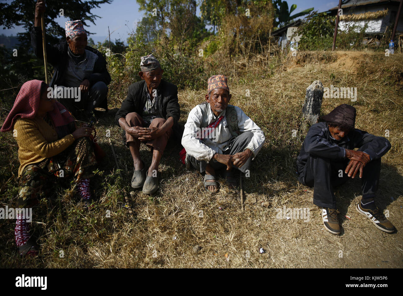 Phidim, Nepal. 26th Nov, 2017. Differently able people sit outside a ...