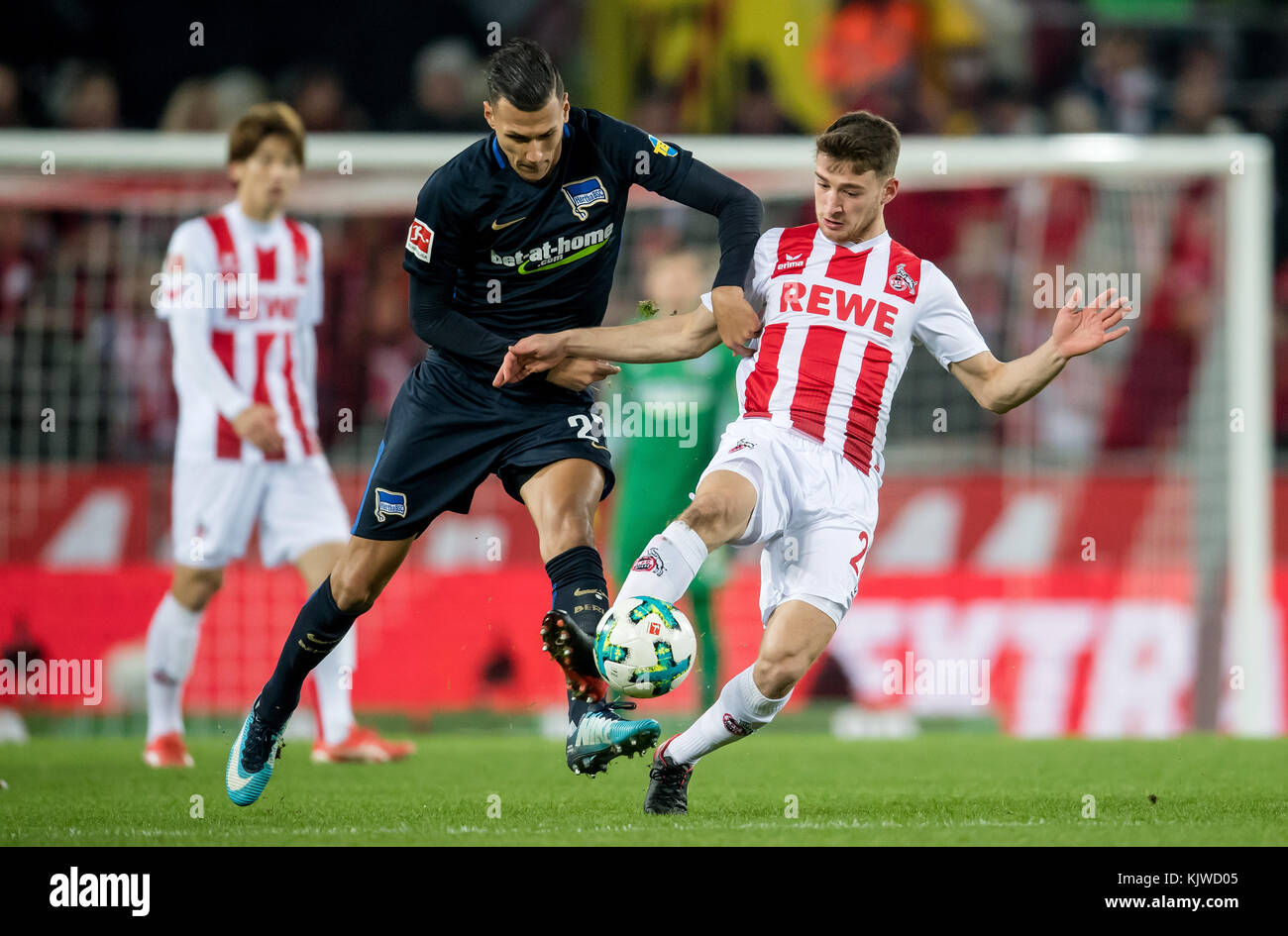 Cologne, Germany. 26th Nov, 2017. Cologne's Salih Oezcan (white) and Hertha's Davie Selke vie ...
