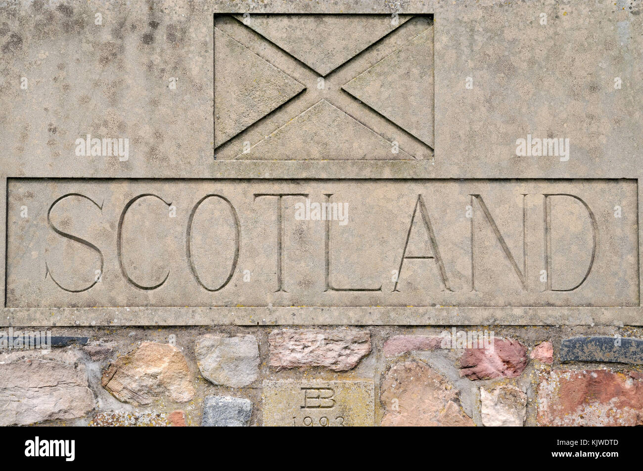 A stone sign reading "Scotland" is posted on the A1 at the English ...
