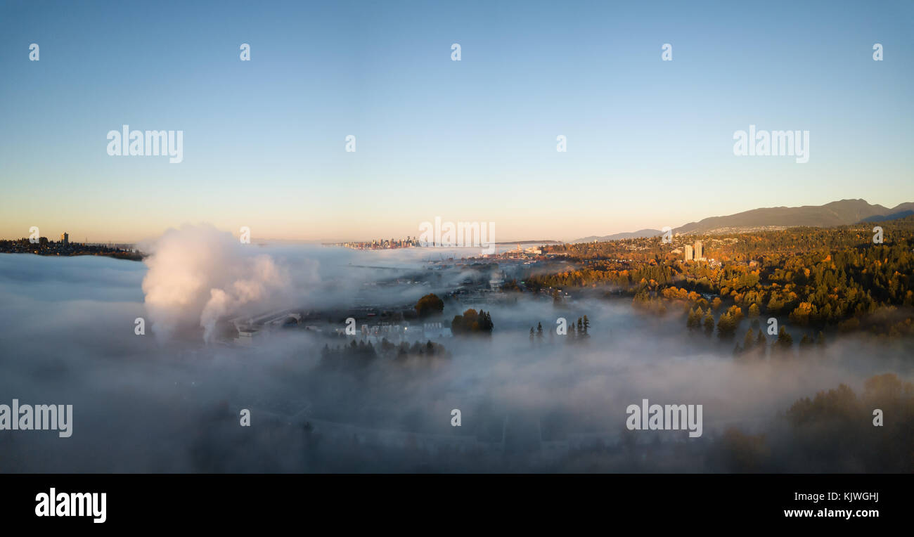 Beautiful aerial panoramic view of the ocean inlet covered in fog ...