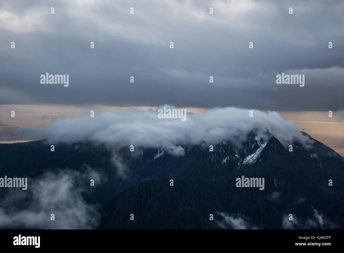 Dramatic Aerial Landscape View of the mountains covered in clouds ...