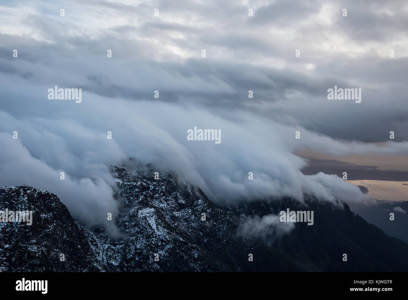 Dramatic Aerial Landscape View of the mountains covered in clouds ...