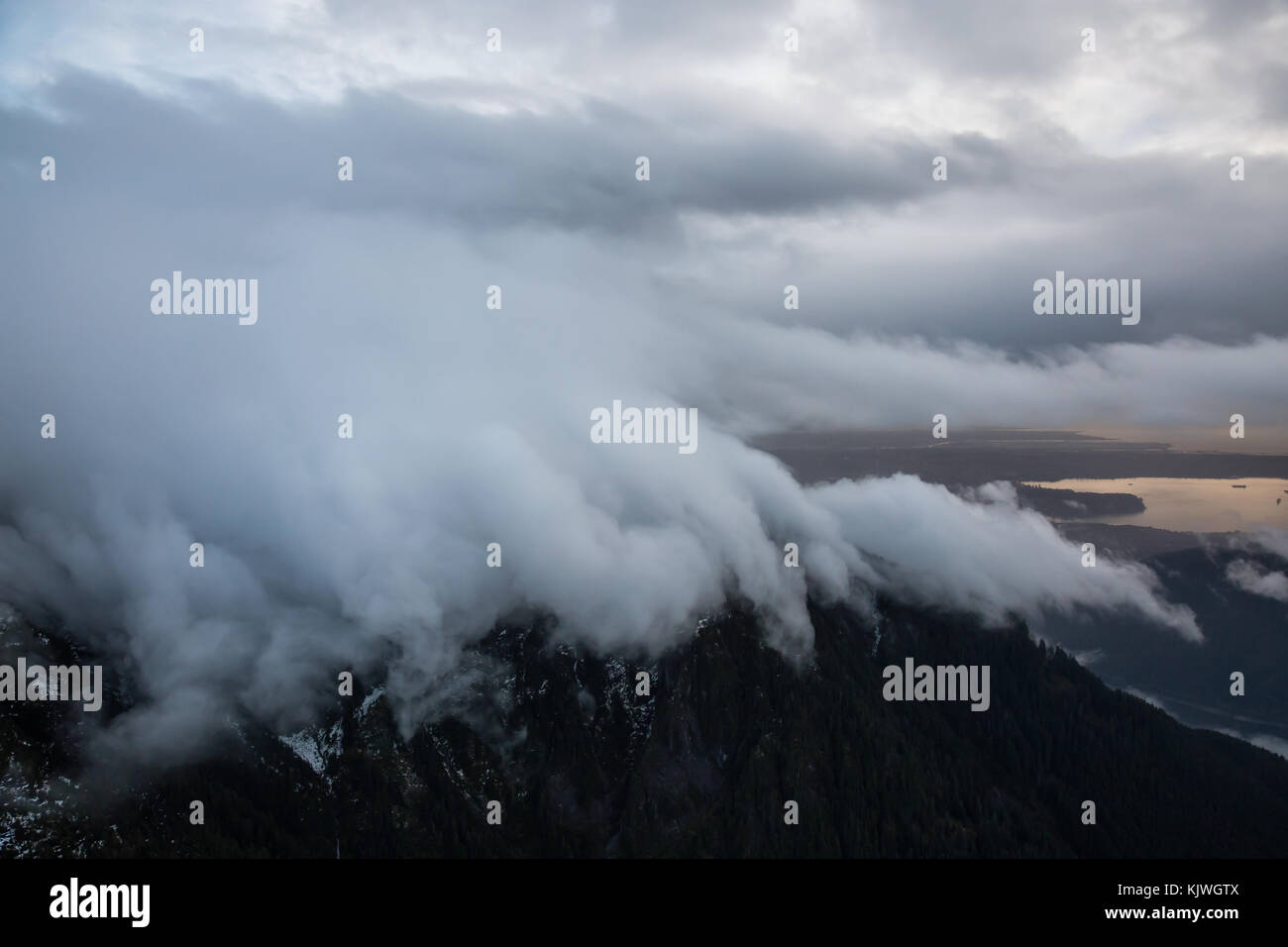Dramatic Aerial Landscape View of the mountains covered in clouds ...