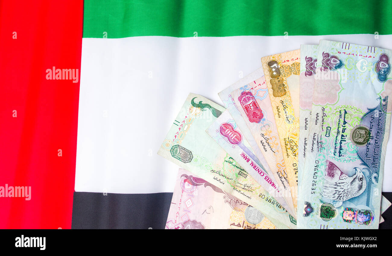 United Arab Emirates dirham banknotes on top of flag Stock Photo - Alamy