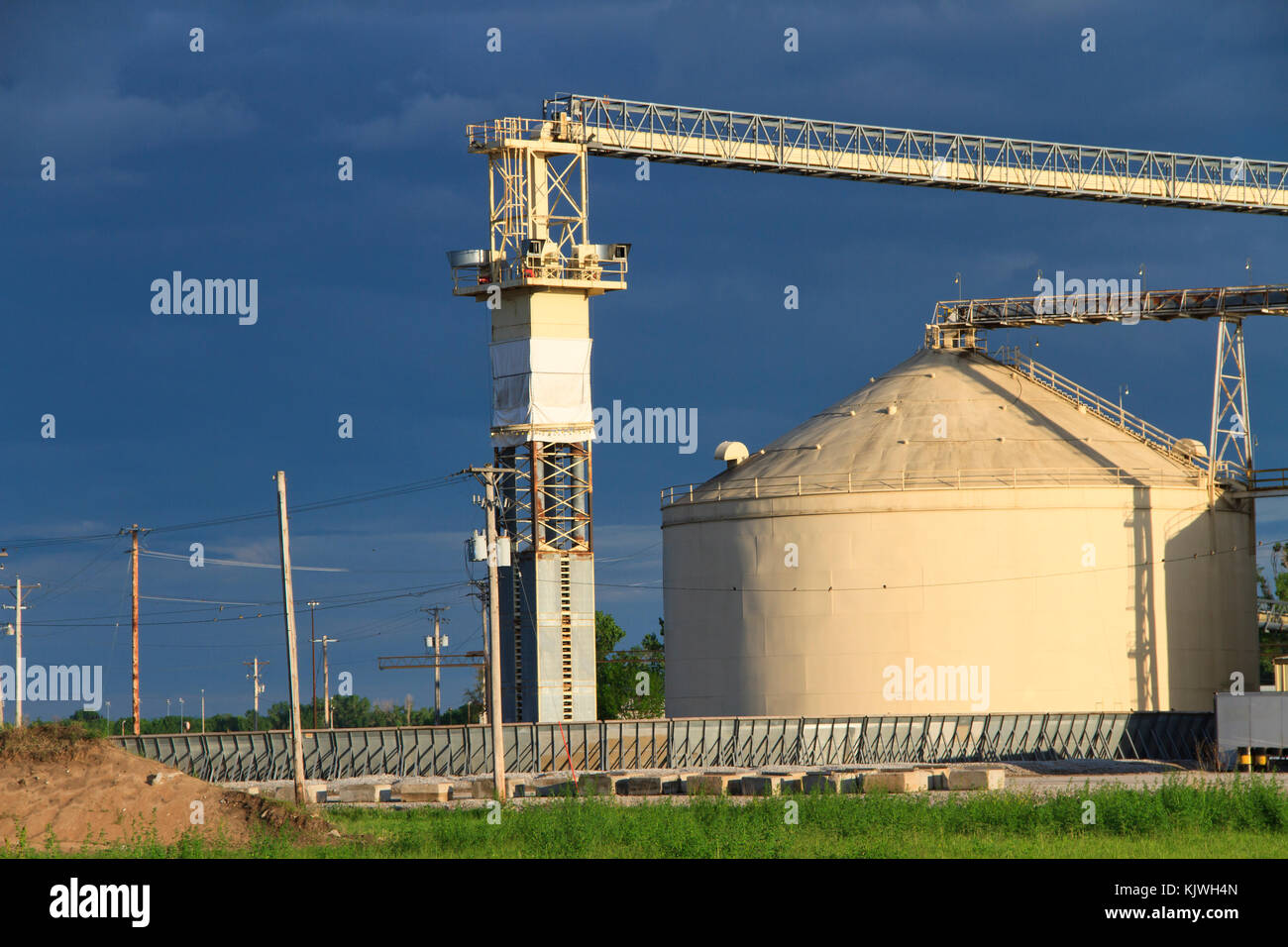 Close up of agriculture equipment and grain elevator on a midwest farm ...