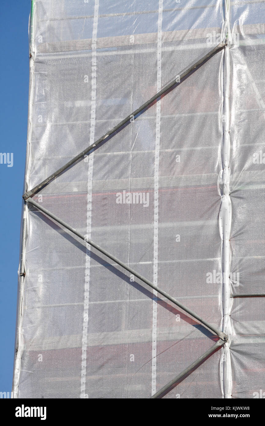 scaffold and Cover tarpaulin on a Construction Site Stock Photo - Alamy