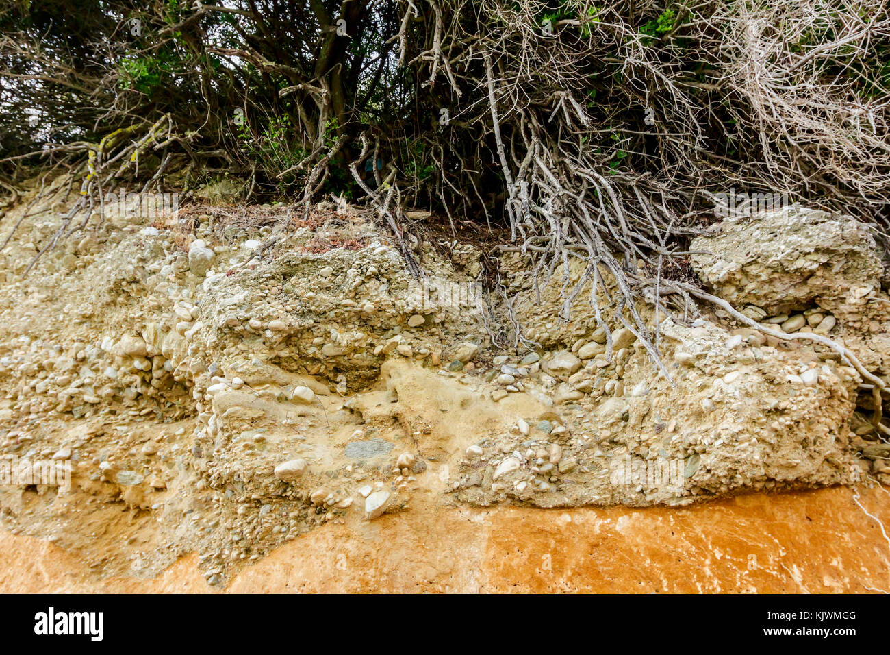 Layers of soil beneath the extreme natural habitat, eroded rugged cliff ...