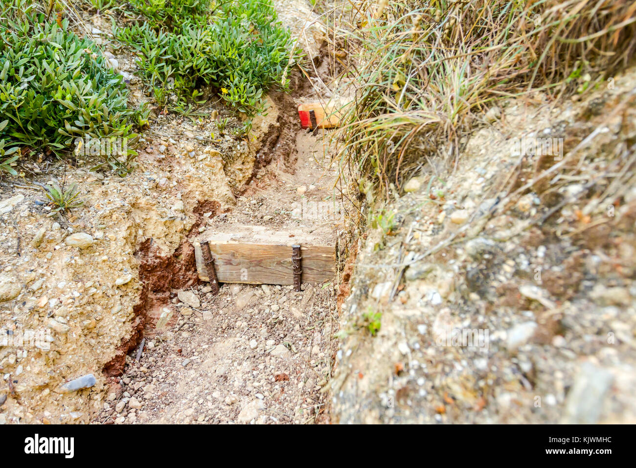 Narrow passage through corridor in rock with carved stairs Stock Photo ...