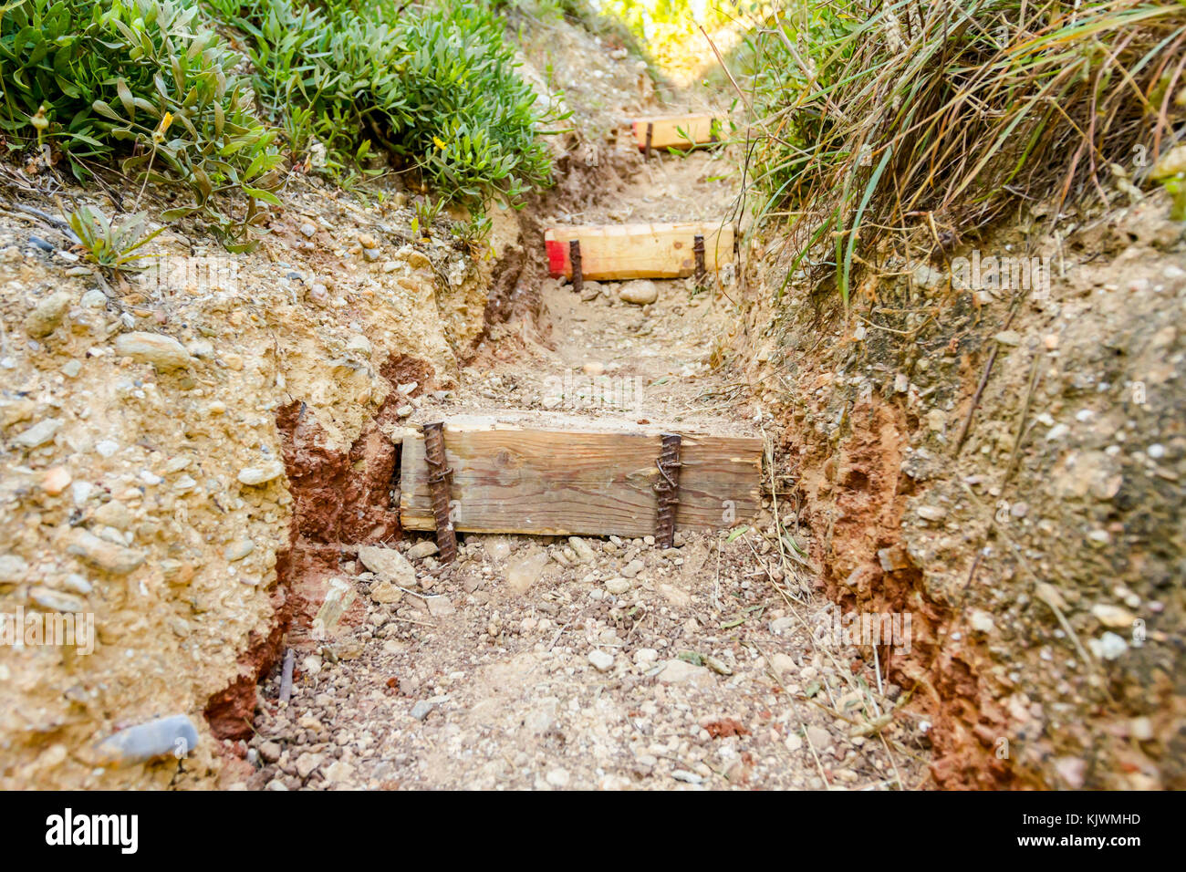 Narrow passage through corridor in rock with carved stairs Stock Photo ...